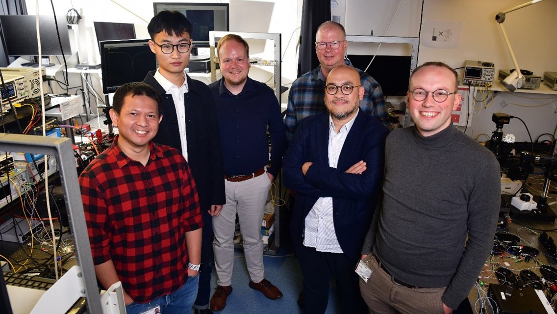 Trapping sound and light on a chip